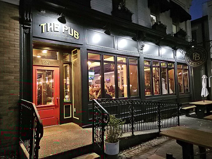 The Pub's warm glow against the night sky acts like a lighthouse for the hungry and thirsty. Nautical metaphors optional, good times guaranteed.