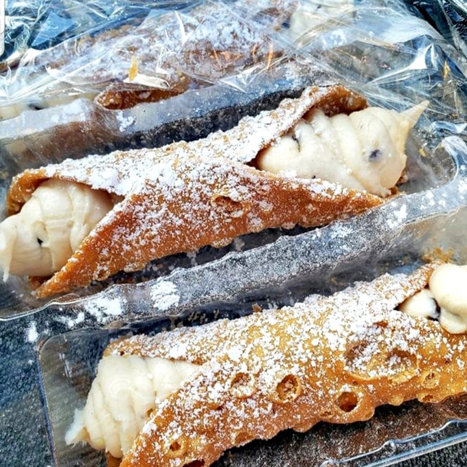 Cannoli so authentic you'll check your passport. That powdered sugar dusting isn't just decoration—it's the final brushstroke on an edible masterpiece.