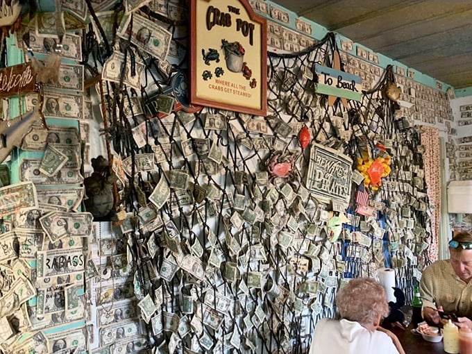 Where patrons leave their mark—and their dollar bills. This wall of currency tells more stories than most restaurant guest books ever could.