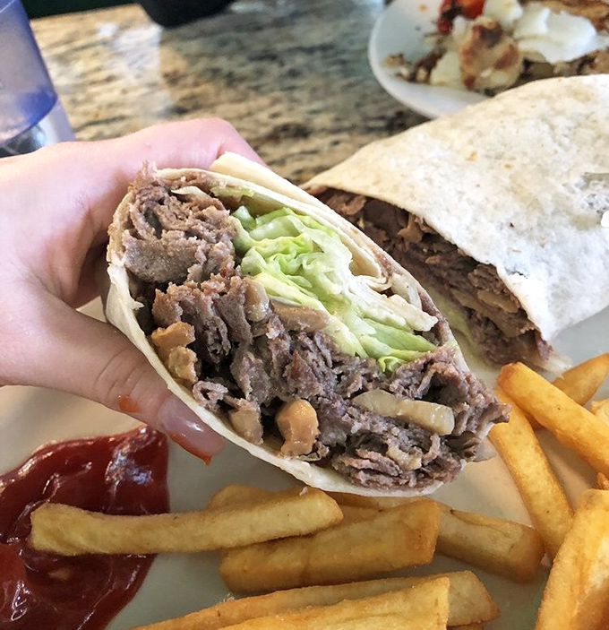 The cheesesteak wrap—Philadelphia's famous sandwich reimagined. Portable perfection with fries that deserve their own fan club.