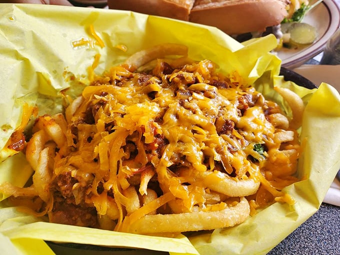 Chili cheese fries that laugh in the face of diet plans—a glorious mess of crispy potatoes, savory chili, and melted cheese worth every napkin.