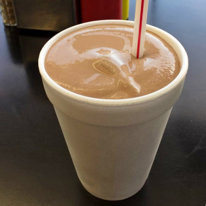 A chocolate shake so thick your straw stands at attention—the perfect cool, creamy counterpoint to the savory sliders.