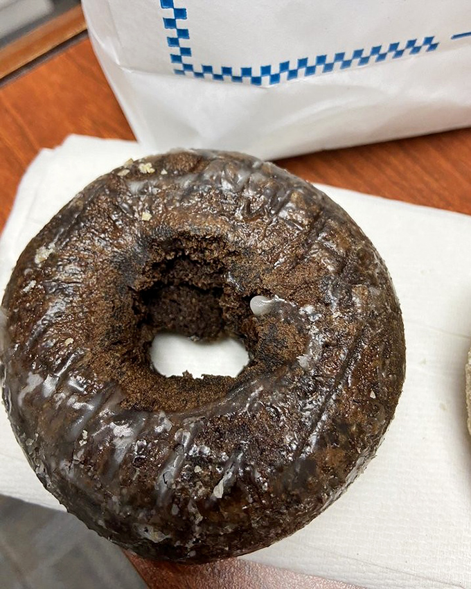 This chocolate cake donut has the kind of deep, rich color that whispers, "I contain enough cocoa to solve all your problems, at least temporarily."