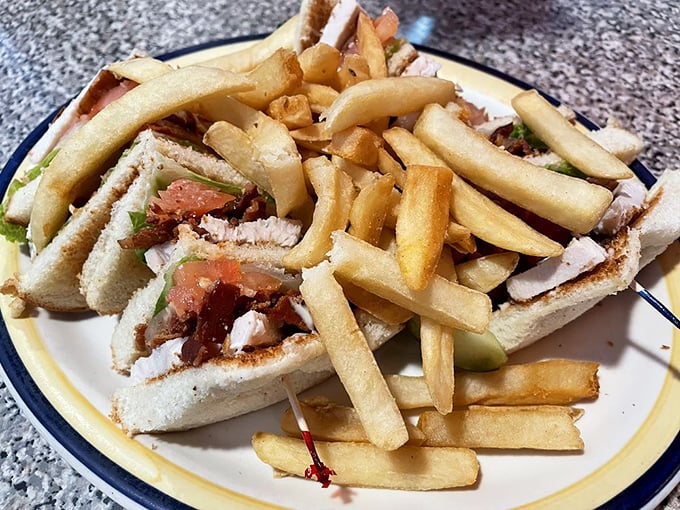The club sandwich—architecture you can eat, with layers of ingredients stacked higher than your weekend to-do list.