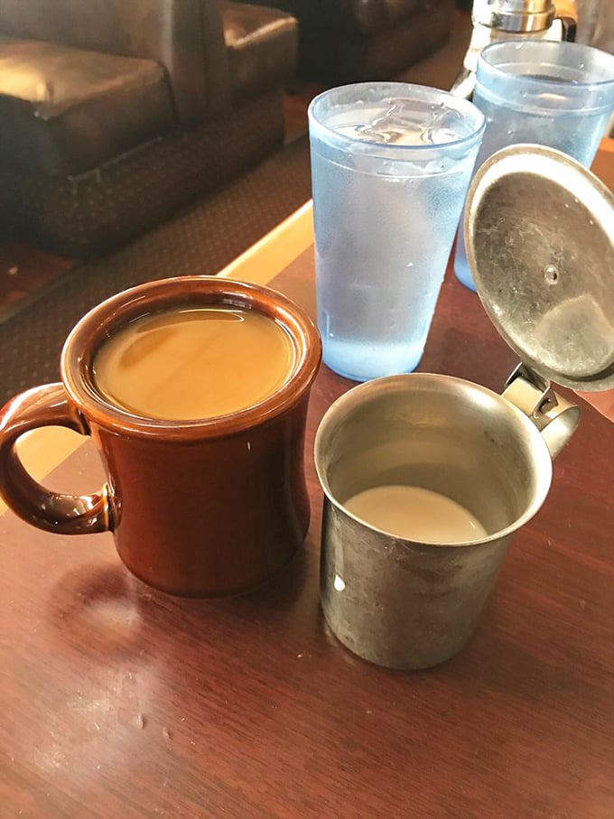 Diner coffee in those sturdy mugs that somehow make everything taste better—the lifeblood of morning conversations everywhere.
