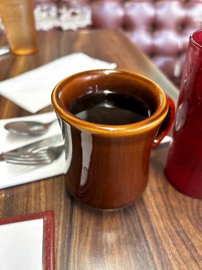 That brown ceramic mug isn't serving single-origin pour-over with tasting notes—it's delivering something better: honest diner coffee that keeps coming until you say when.