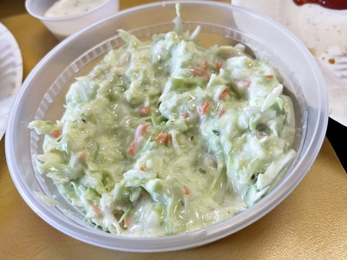 Creamy coleslaw: the unsung hero of fish and chips. This cool, crunchy side provides the perfect counterpoint to all that glorious fried goodness.