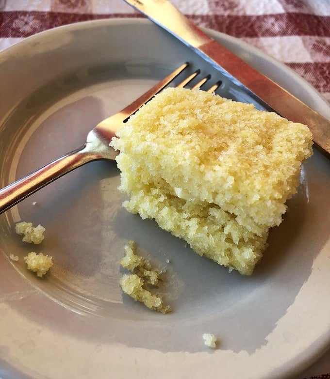 Cornbread so moist it should be illegal in seven states. The kind that makes you forget your "no carbs" promises from breakfast.