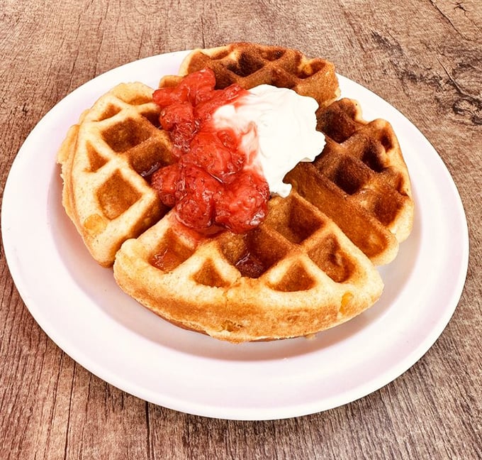 A waffle that's having an identity crisis in the best possible way – breakfast meets dessert with a side of "why haven't I tried this before?"