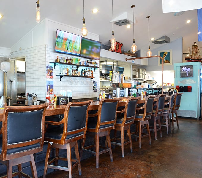 Bar seating that invites lingering. Those leather-backed stools have witnessed countless fishing tales, each growing taller with every round.