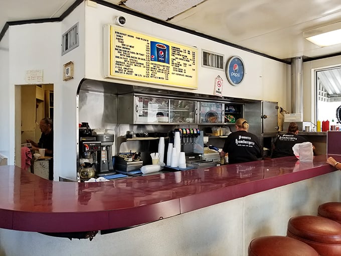 Behind this counter, burger magic happens with the efficiency of a Swiss watch and the soul of a Motown hit – precise yet full of heart.