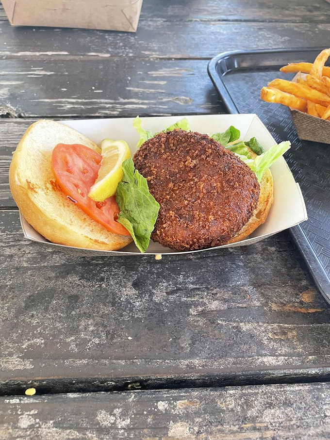 A crab cake sandwich that respects the crab – minimal filler, maximum flavor. The kind of sandwich that makes you wonder why you ever eat anything else.