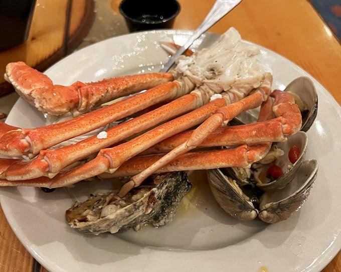 Ocean meets plate in this symphony of shellfish. Crab legs and clams coexisting peacefully—unlike your opinions about who gets the last piece.