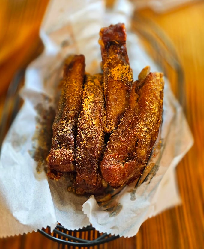 These aren't just ribs – they're meat candy. Dusted with seasoning and fried to perfection, they're the finger food that makes you forget about table manners.