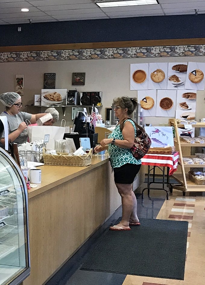 The time-honored tradition of pie procurement in progress. That look of anticipation is universal—pie joy knows no boundaries.