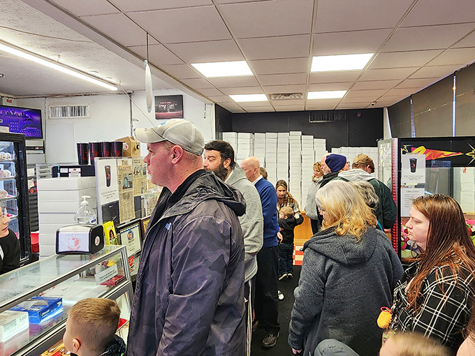 The morning rush at Donut Land – where strangers become friends united by the universal language of fried dough appreciation.