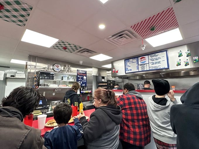 The lunch rush at Powers isn't just about food—it's a community gathering where strangers become neighbors over the shared language of great burgers.