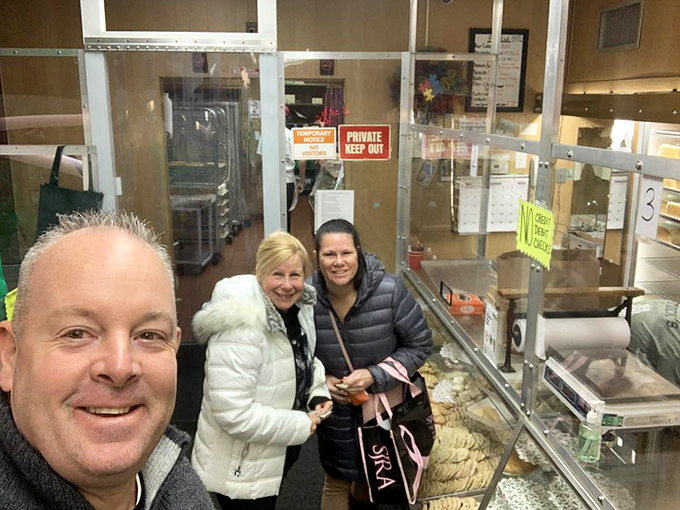 Happy pilgrims at the promised land of pound cake. Their smiles say what we're all thinking: "Worth the trip!"
