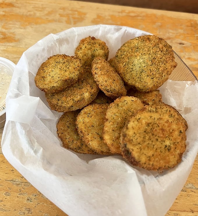 These aren't just fried pickles—they're crunchy little discs of tangy perfection that disappear faster than your willpower.
