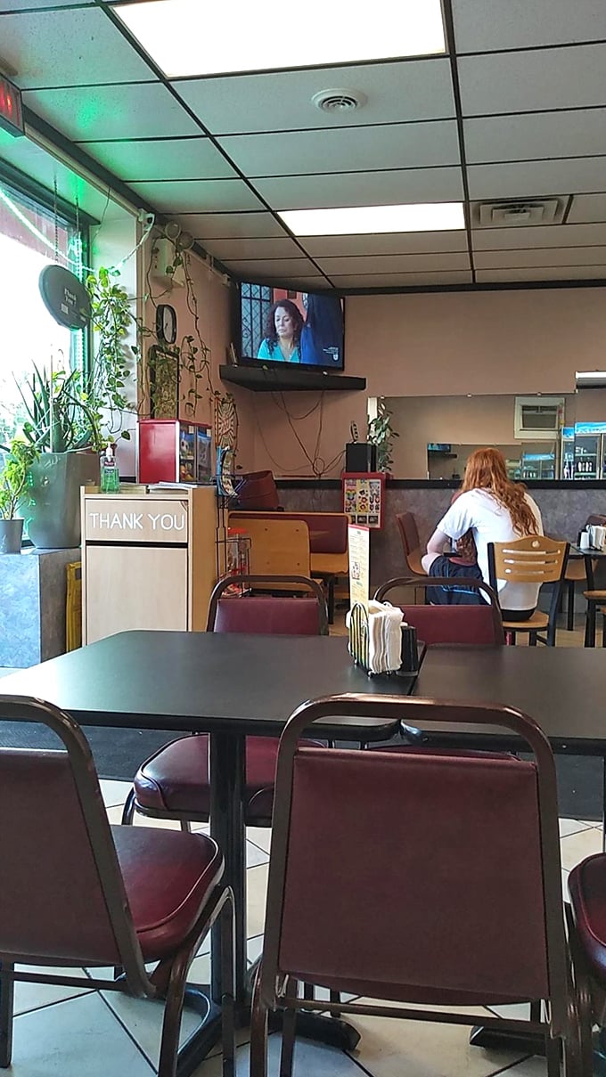 A quiet moment in the dining area where countless food memories have been made. The TV ensures you never miss the game while enjoying your feast.