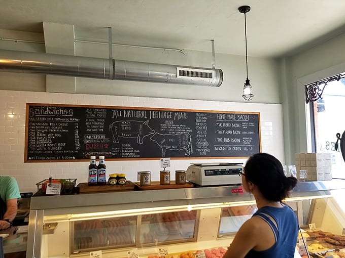 The chalkboard diagram of heritage pork cuts serves as both education and temptation—meat geography lessons never tasted so good.