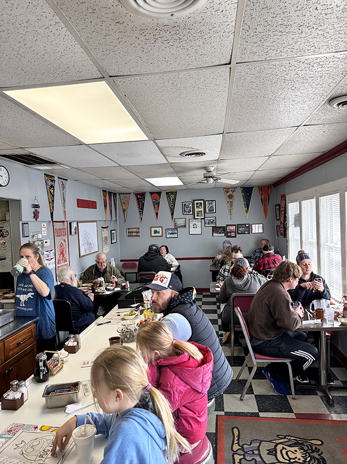 The weekend breakfast crowd at Gina's—a beautiful cross-section of humanity united by the universal language of "pass the syrup, please."