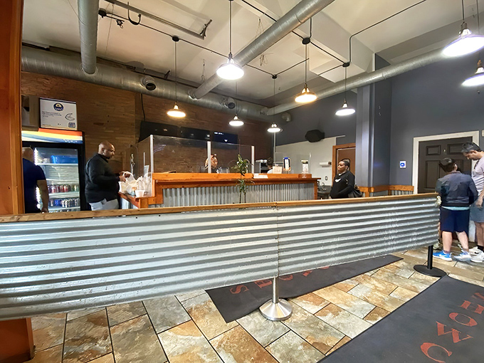 The ordering counter where barbecue dreams come true. That corrugated metal isn't just decor—it's a signal that serious smoking happens here.