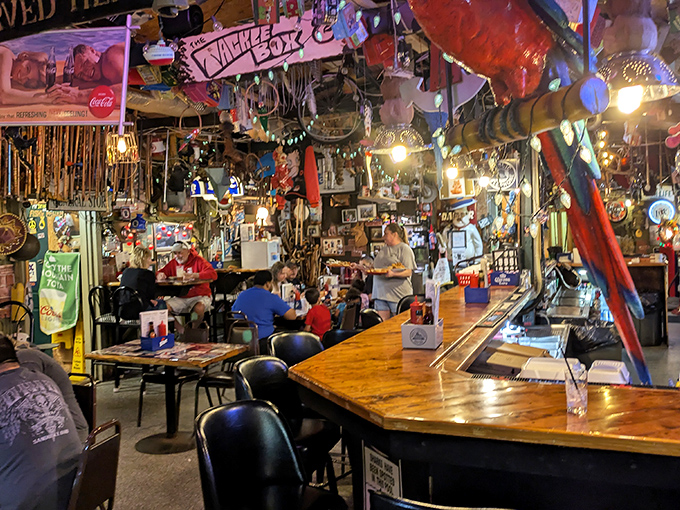 Where fishing tales and food appreciation meet – patrons gather under a ceiling draped with memorabilia in this temple to unpretentious dining.