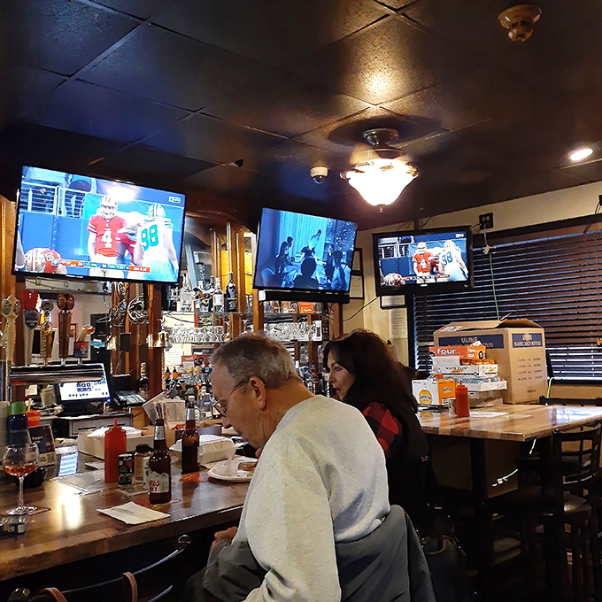 The bar area – where locals gather to debate Eagles prospects while enjoying sandwiches that require both hands and complete concentration.