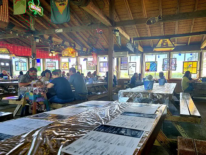 The picnic-style seating area where strangers become friends over shared love of seafood. Notice the plastic tablecloths—things are about to get deliciously messy.