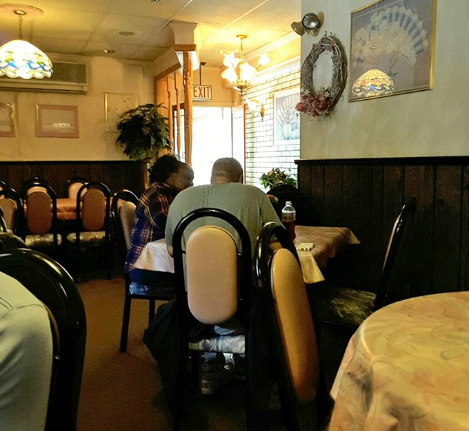 Regulars know the unspoken rule – no serious conversations until you've figured out your sandwich attack strategy.