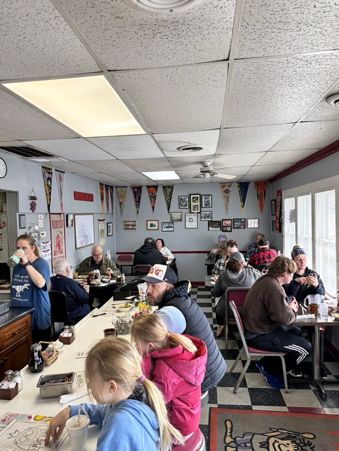 Not a phone in sight—just people enjoying real food and conversation in a place where community happens naturally between bites of breakfast.