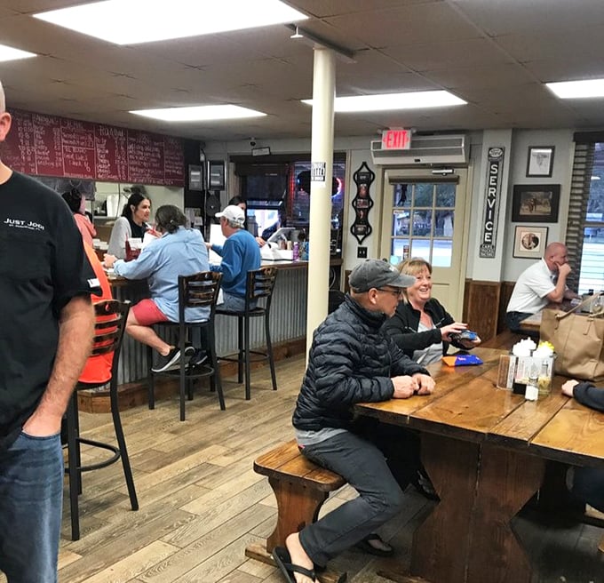 Happiness is a full table at a barbecue joint where strangers become friends united by the universal language of "mmm" and "pass the napkins."