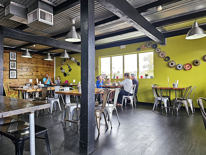 Where strangers become friends over shared food revelations. The lime-green walls and vintage bundt pan display create conversation starters before the food even arrives.