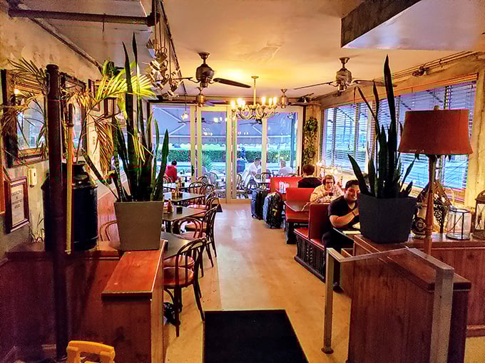 Evening ambiance that makes you want to linger just a little longer. Those tall plants aren't just decor—they're creating little islands of privacy.