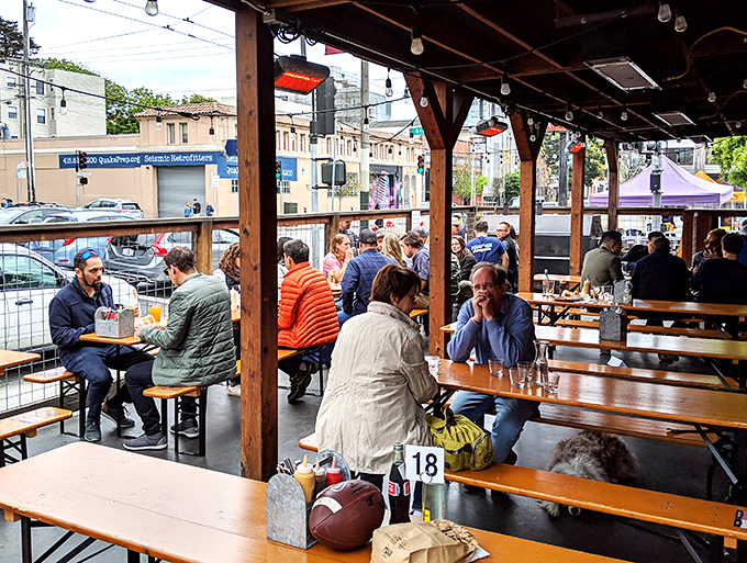 The outdoor patio: where strangers become friends, united by the universal language of "Did you try the brisket yet?"