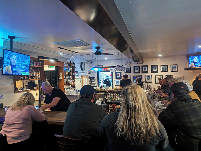 The bar scene—where strangers become friends over shared appreciation of properly cooked beef and cold drinks. Democracy in delicious action.
