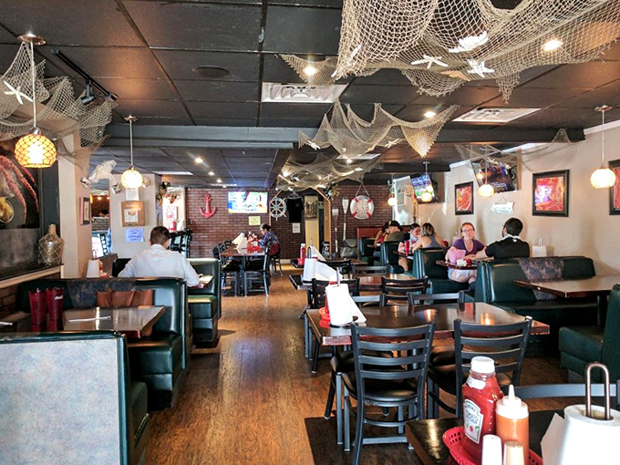 Fishing nets on the ceiling, seafood on the tables. This dining room isn't decorated—it's setting the stage for maritime magic.
