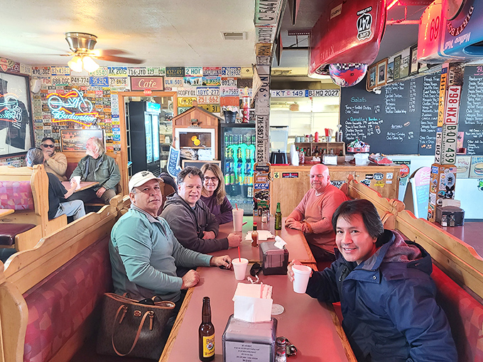 The true heart of any great roadside spot—happy diners creating memories over meals that taste even better with good company.