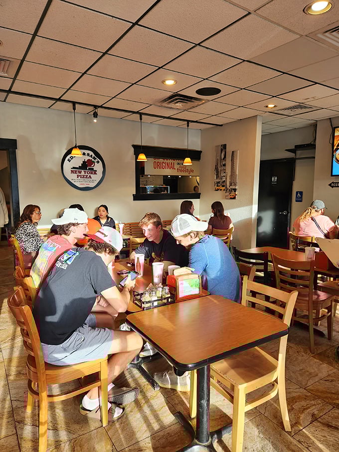 Where strangers become friends over the universal language of exceptional pizza. Notice nobody's looking at their phones—the food demands attention.