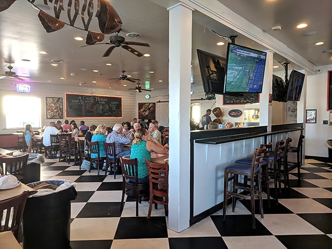 The black and white checkered floor adds a retro charm, while diners focus on what matters—getting every last morsel of seafood.