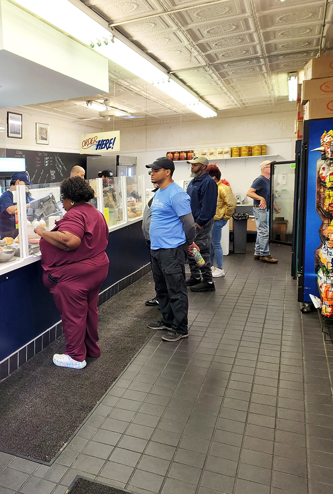 The lunch line forms with purpose – these customers aren't just waiting for food; they're participating in a Philadelphia ritual.