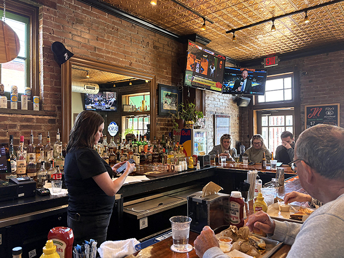 The bar scene at Jack Nolen's: where strangers become friends over smashburgers and local brews. St. Louis hospitality in liquid and solid form.
