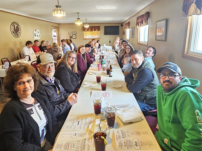 Multi-generational gatherings around these tables aren't just meals—they're memory factories. The smiles suggest the chicken has worked its magic once again.
