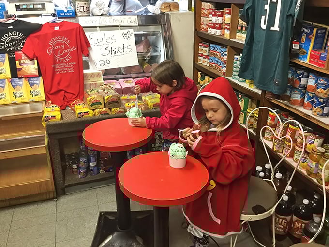 Young diners discover the joy of Gooey Looie's ice cream, proving that sandwich enlightenment can wait until after dessert.