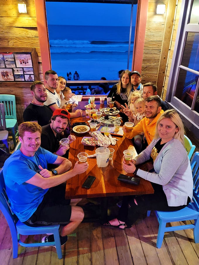 Sunset dining at its finest—where families and friends gather to celebrate the holy trinity of vacation: good food, cold drinks, and Gulf views.