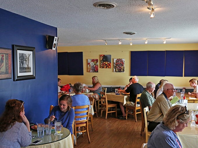 Blue and yellow walls create the perfect backdrop for breakfast enthusiasts. Every table tells a story of hunger satisfied and days well-begun.