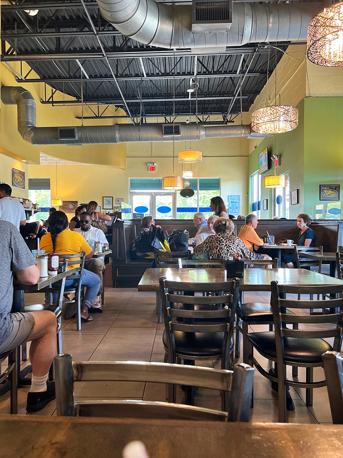 Happy diners enjoying the kind of meal that turns strangers into friends over shared breakfast bliss.