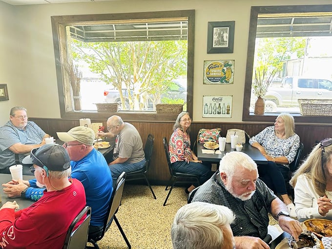 The true measure of a barbecue joint: locals of all ages gathering to worship at the altar of smoked meats. No phones in sight, just people living in the moment.