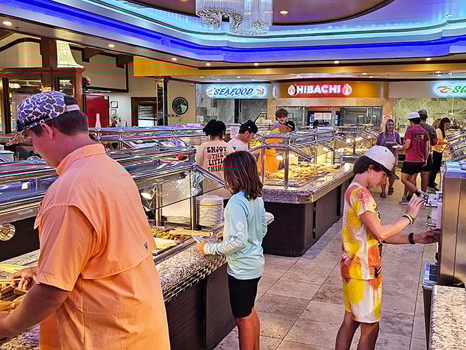 The buffet in action—a choreographed dance of plate-filling and decision-making that brings together strangers in the universal pursuit of abundance.